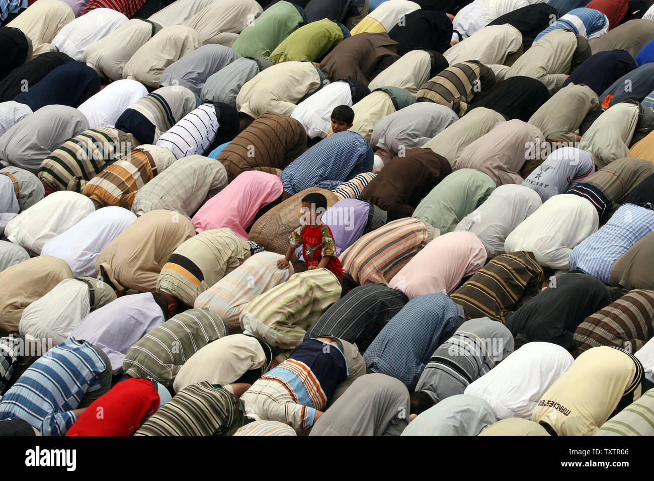 Iraqi pilgrims pray at the shrine of Imam Musa al-Kazim in Baghdad ...