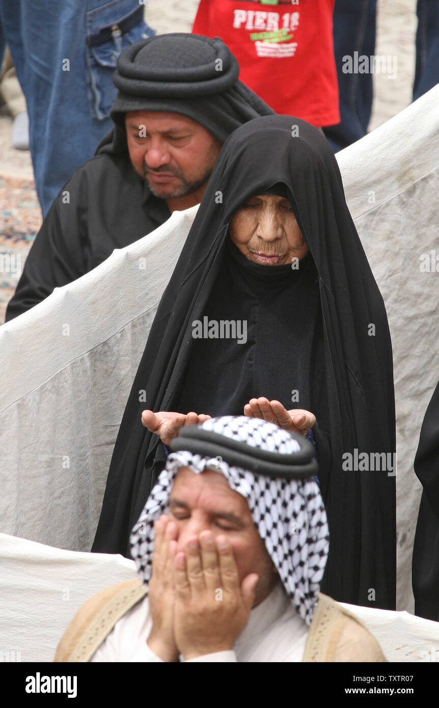 Iraqi pilgrims pray at the shrine of Imam Musa al-Kazim in Baghdad ...