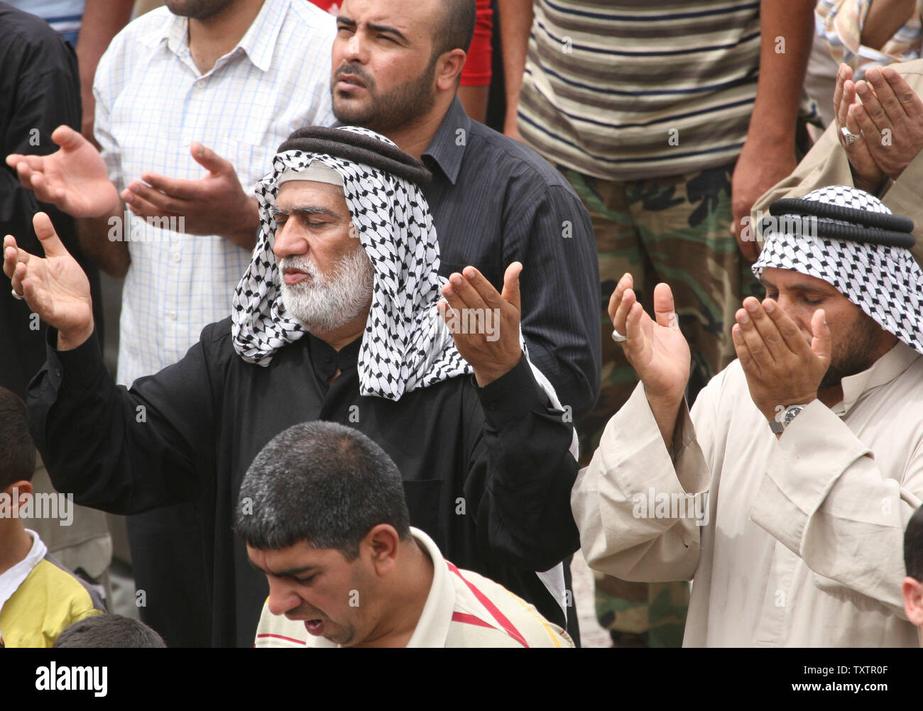 Iraqi pilgrims pray at the shrine of Imam Musa al-Kazim in Baghdad ...