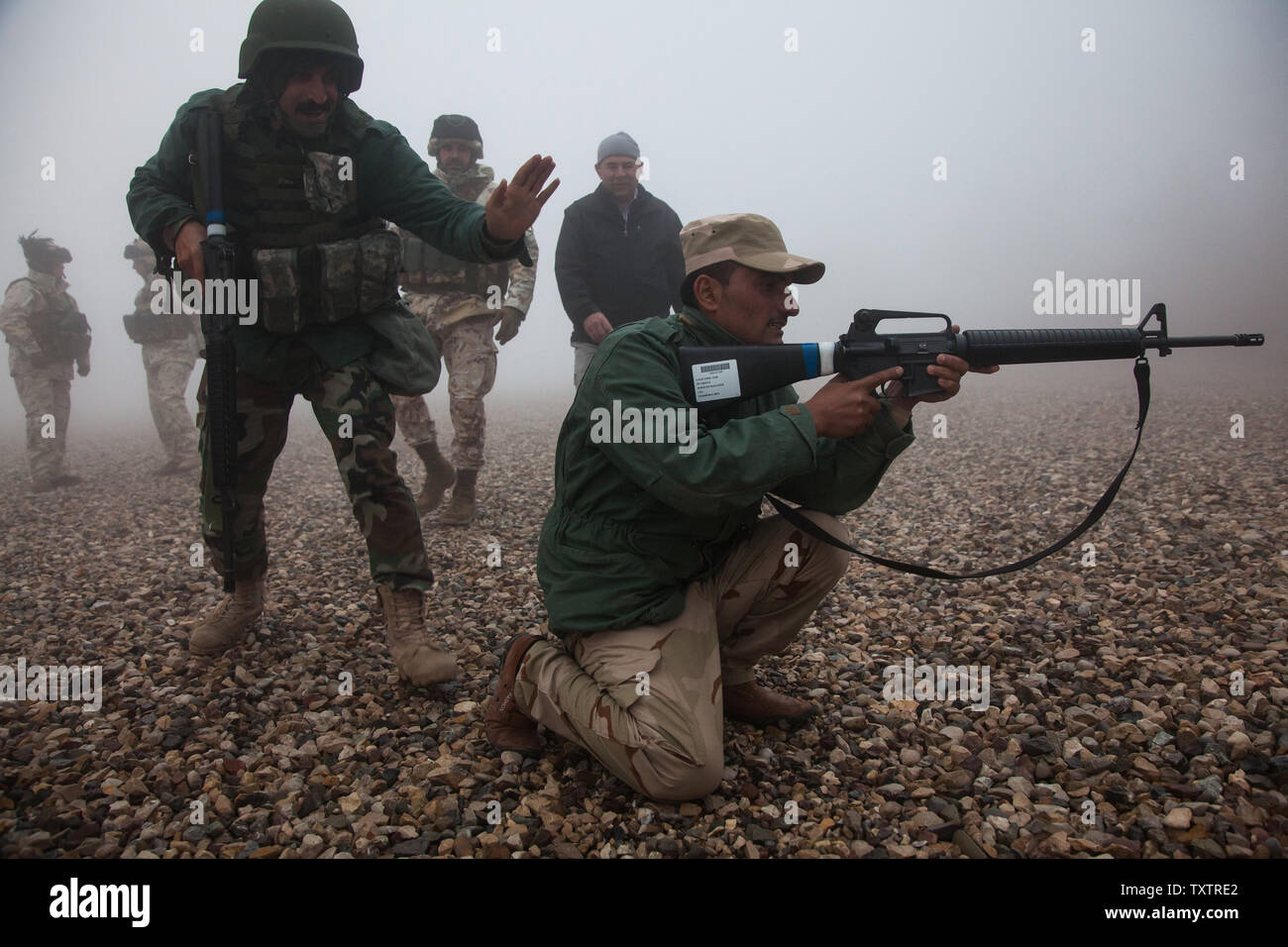 Peshmerga soldiers conduct tactical movements during a live-fire ...