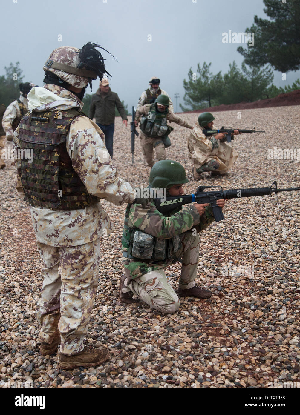 Peshmerga soldiers aim at 20-meter targets while conducting tactical ...