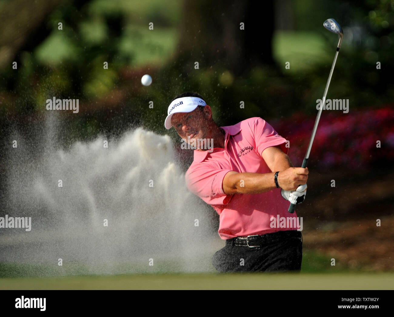 Alex Cejka hits out of a bunker and onto the 14th green during the ...