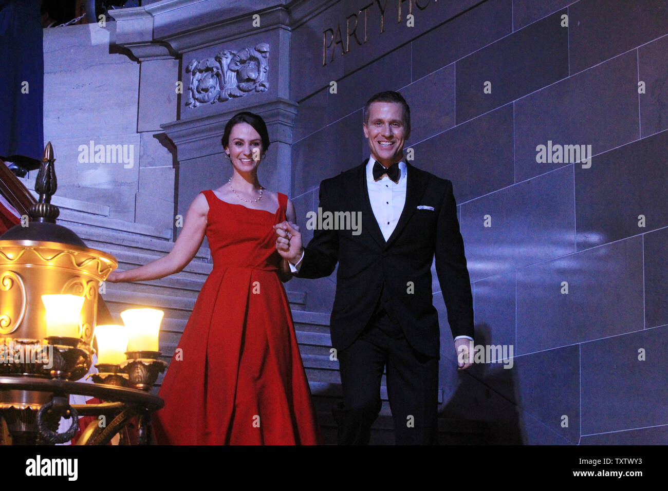 Missouri Governor Eric Greitens and his wife Sheena decend the stairs ...