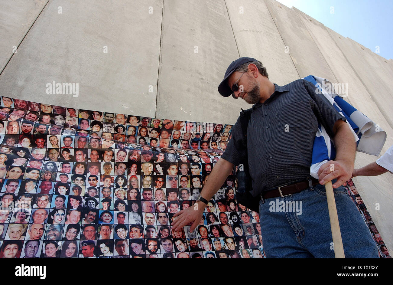 Israeli Arnold Roth points to a photo of his daughter, Malki, 15, who ...