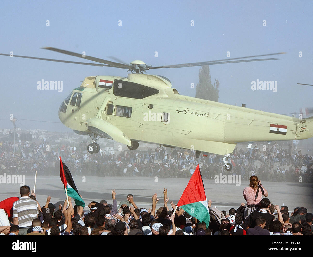 Palestinians meet an Egyptian helicopter carrying the coffin of ...