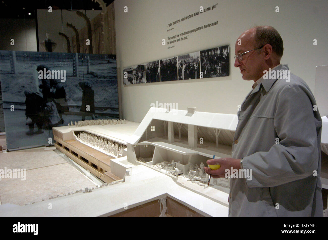 Polish Artist, Jack Stobievski works on a model of the Auschwitz ...