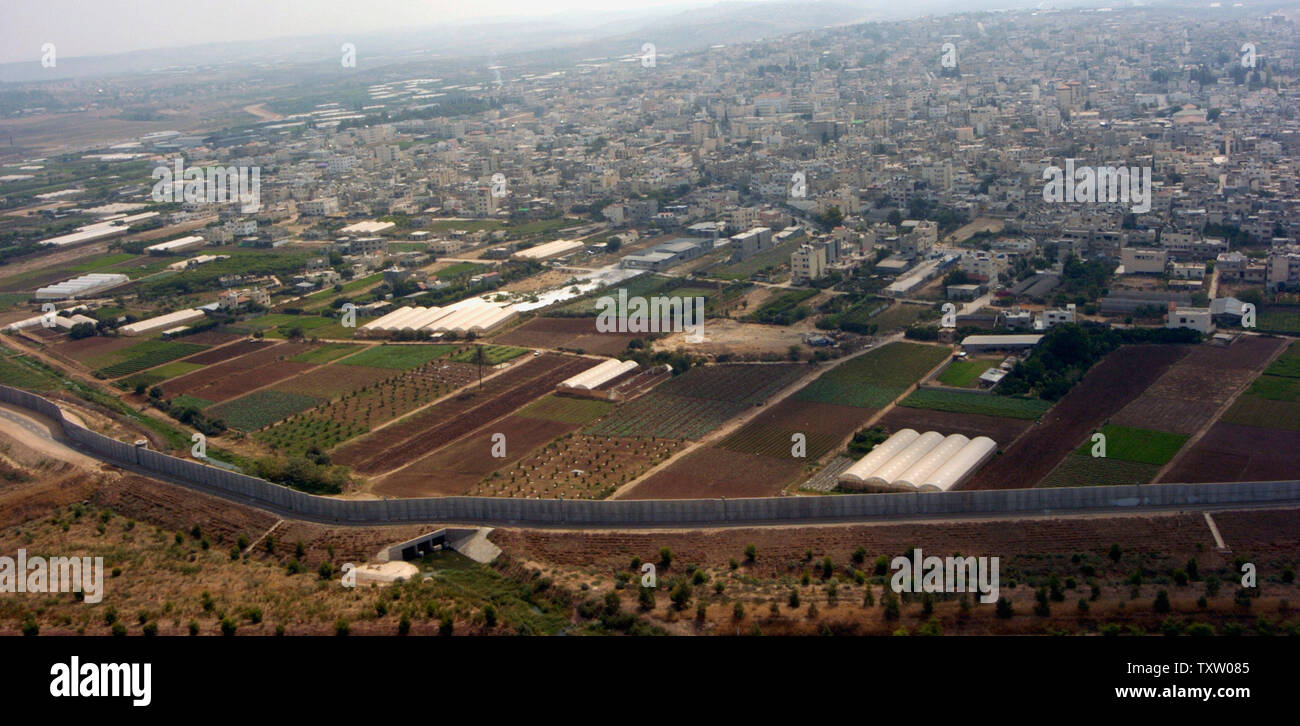 The Palestinian West Bank town of Qalqilya is seen behind the Israeli ...