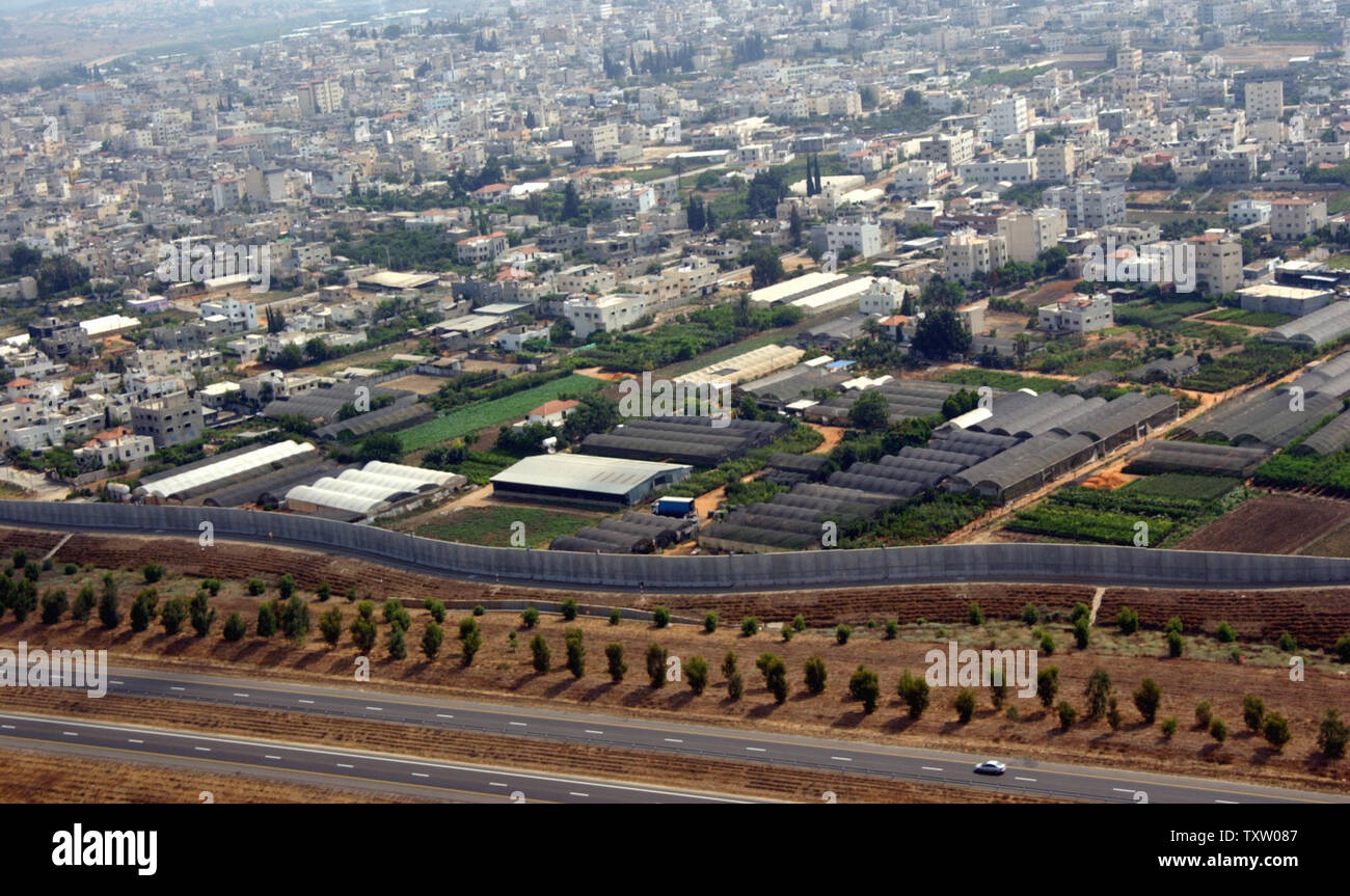 The Palestinian West Bank town of Qalqilya is seen behind the Israeli ...