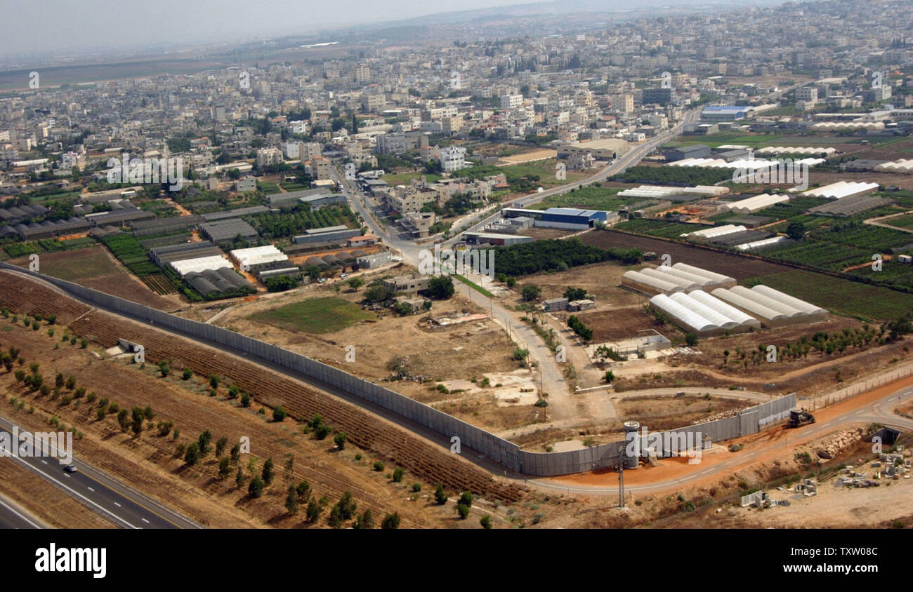 The Palestinian West Bank town of Qalqilya is seen behind the Israeli ...
