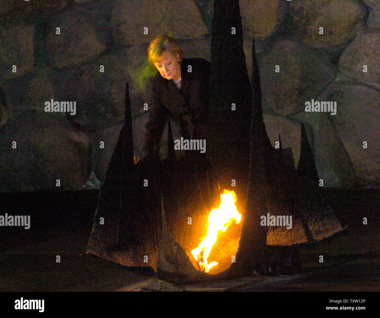 German Chancellor Angela Merkel lights the eternal flame in the Hall of ...