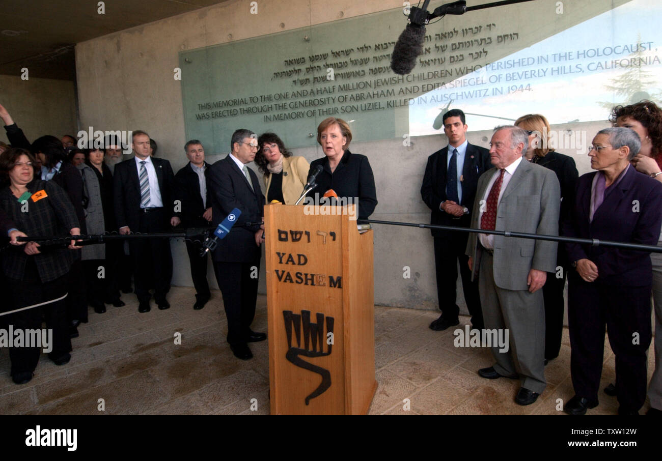 German Chancellor Angela Merkel joins Yad Vashem Director Avner Shalev ...