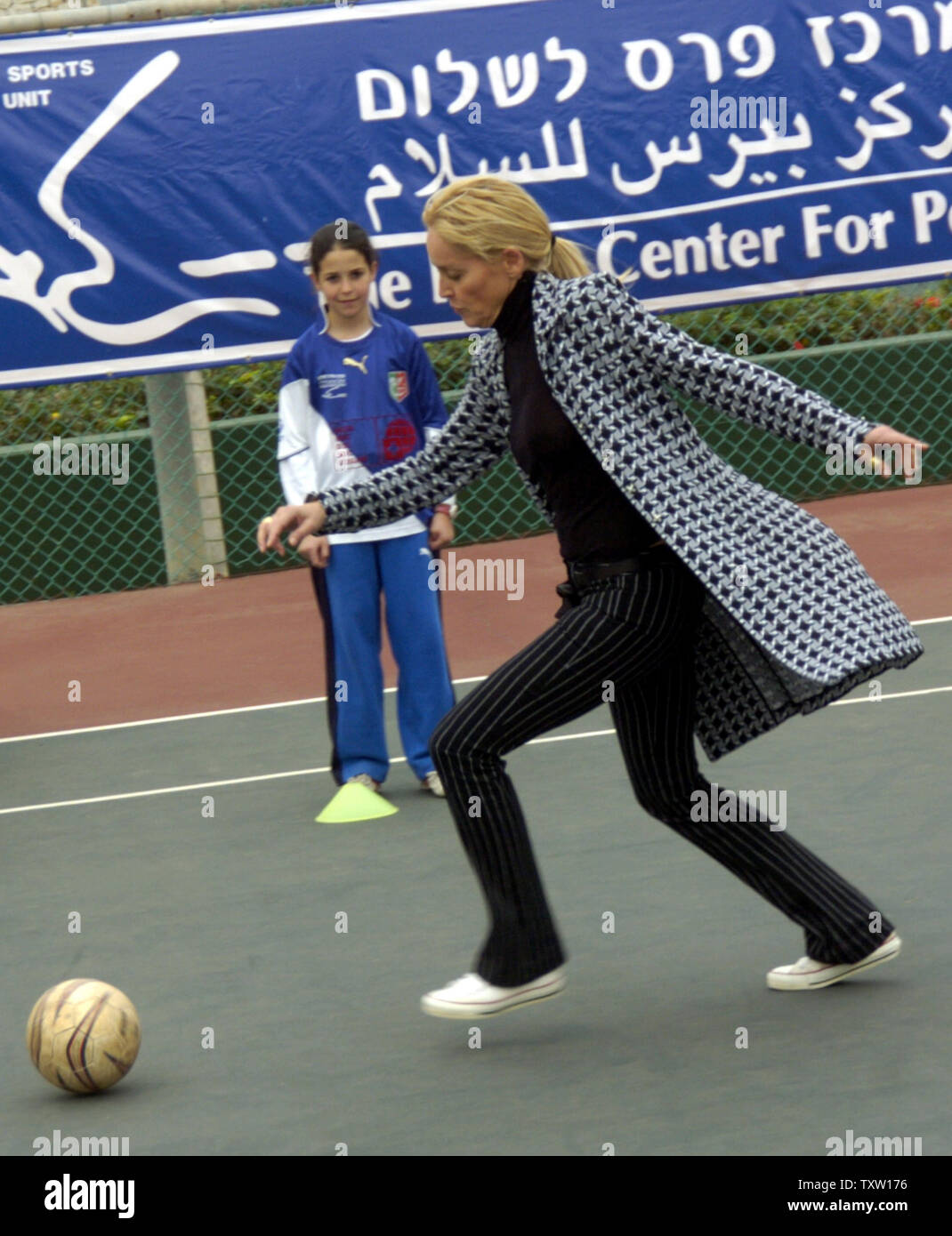 Actress Sharon Stone plays soccer with children in a join Israeli ...
