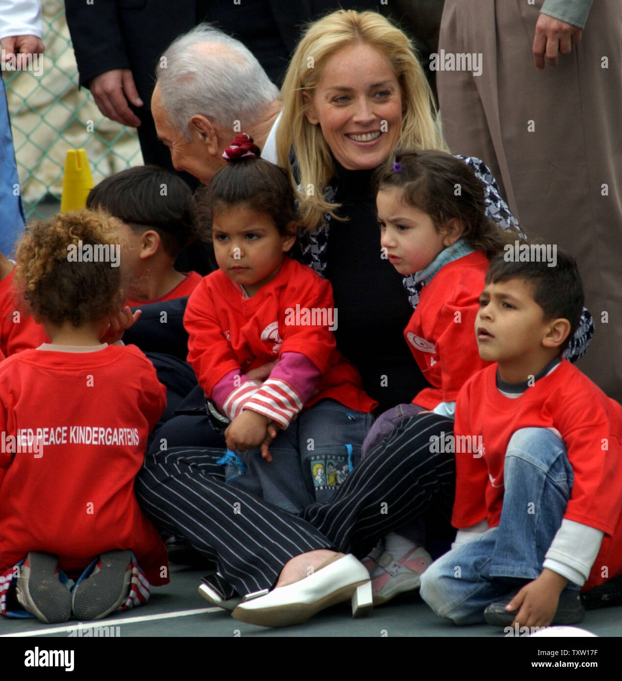 Actress Sharon Stone holds children participating in a join Israeli ...