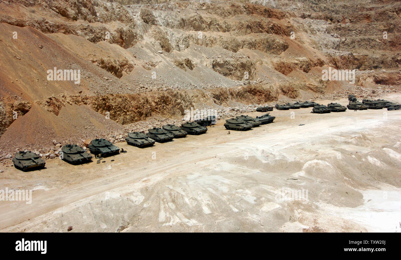 Israeli tanks wait to enter Lebanon at a staging position near the ...