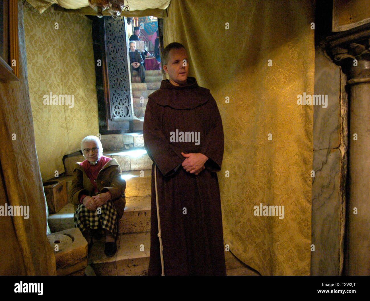 Catholics pray in the grotto in the Church of Nativity, where tradition ...
