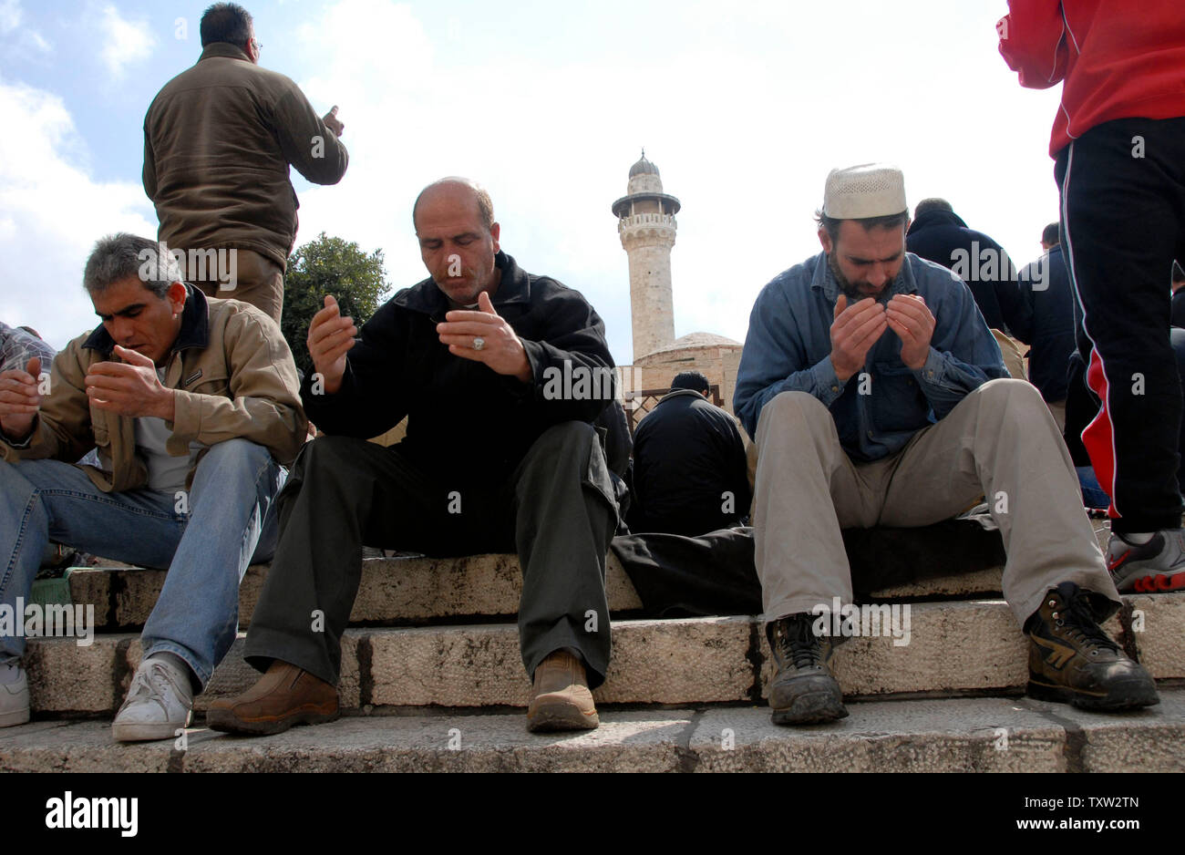 Muslims pray outside the Al-Aqsa Mosque Compound in the Old City of ...
