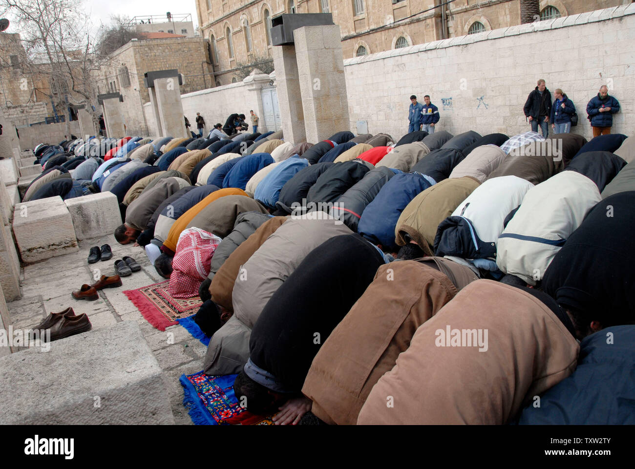 Muslims pray outside the Al-Aqsa Mosque Compound in the Old City of ...