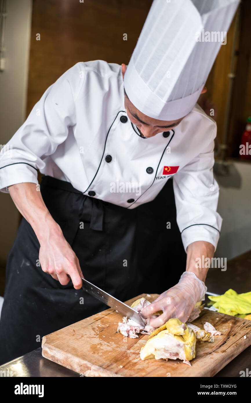 Sibiu City, Romania - 23 June 2019. Chinese cook arranges food on ...