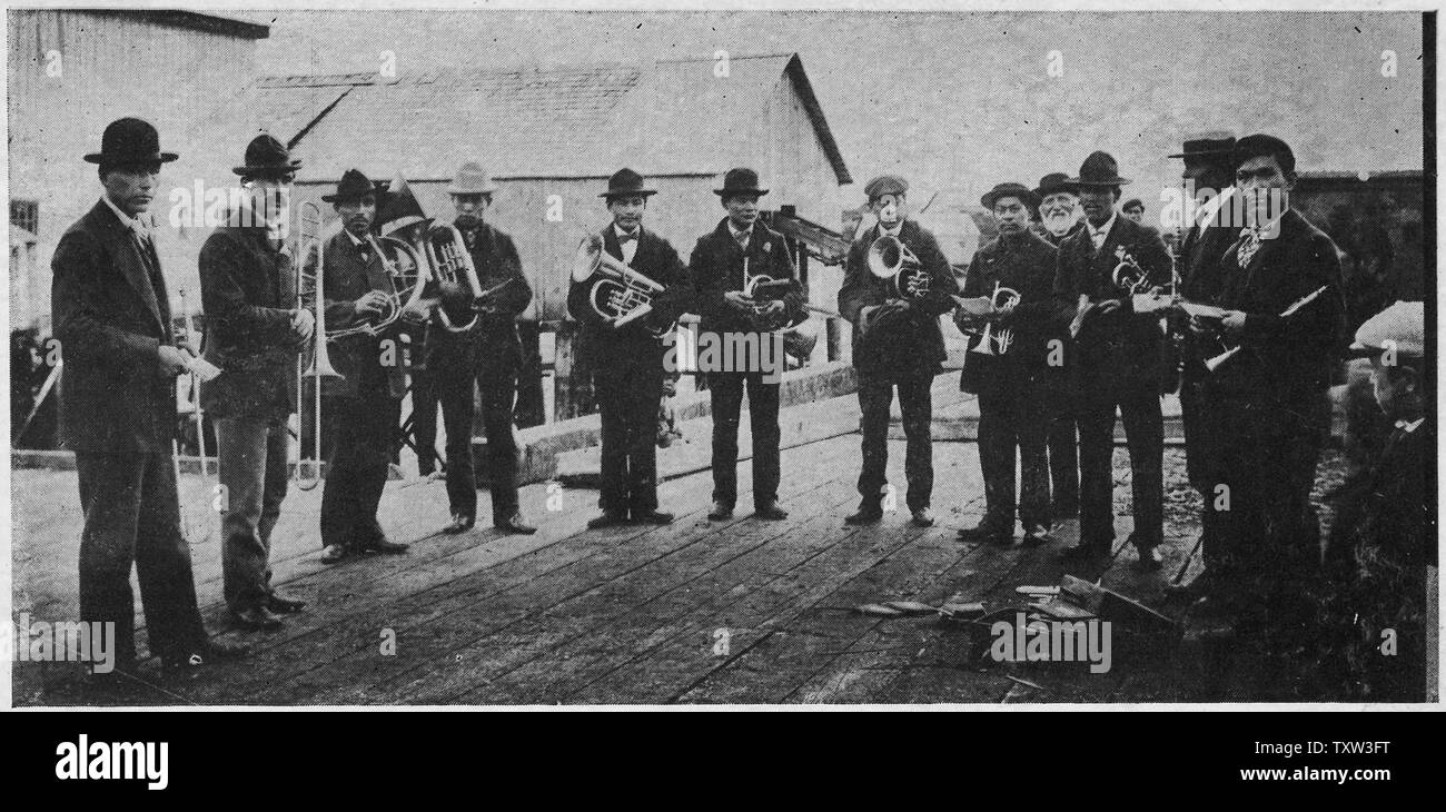 A portion of Metlakahtla Brass Band on wharf at Metlakahtla with ...