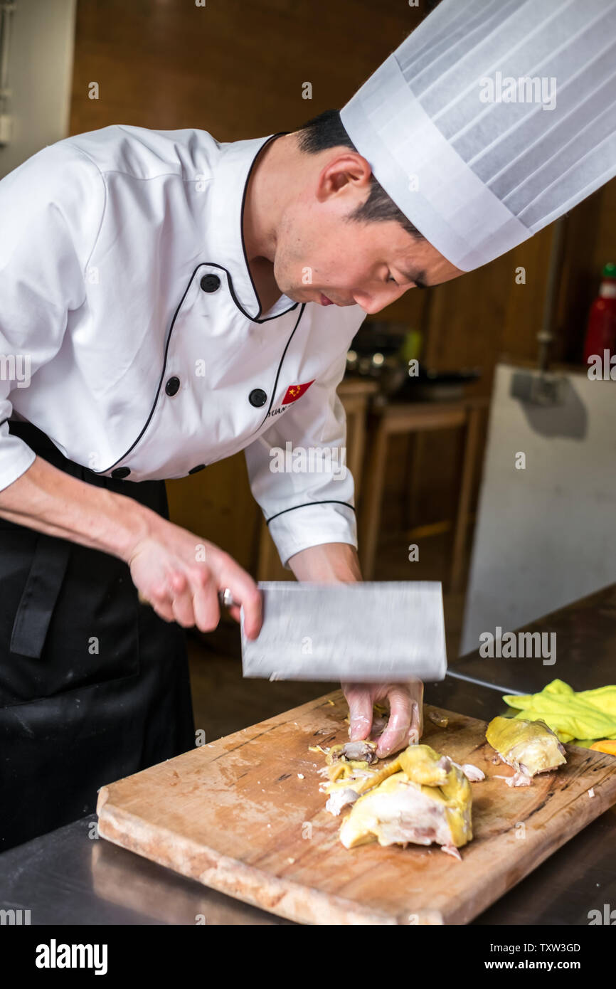 Chinese cook arranges food on plates at the premiere of Lantern ...