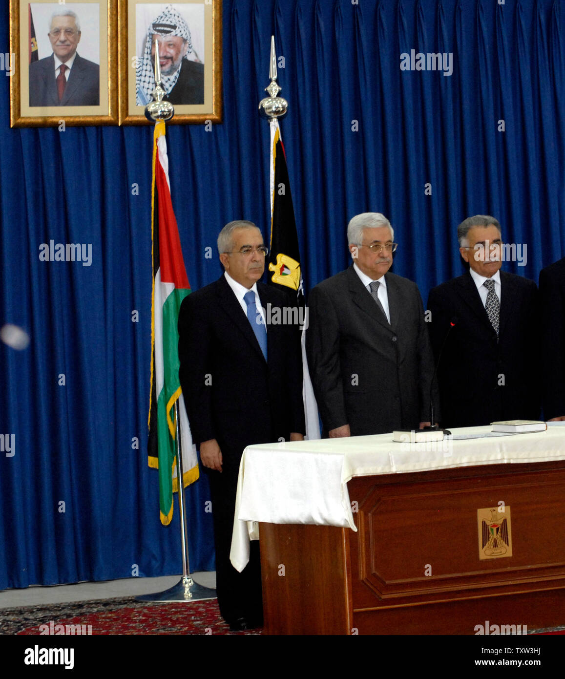 Newly sworn in Prime Minister Salam Fayad and Palestinian President ...