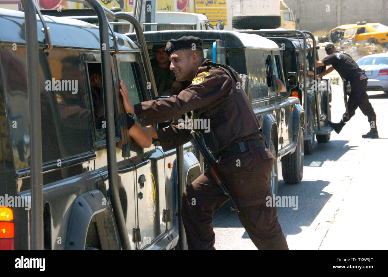 Members of Palestinian President Mahmoud Abbas security forces secure ...