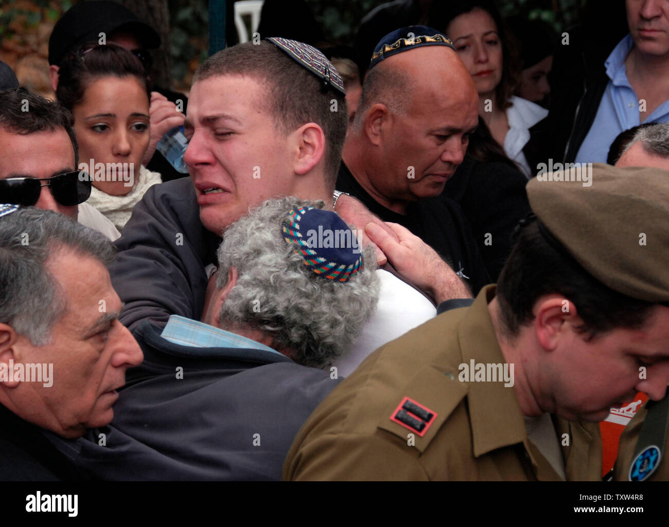 The brother Staff Sergeant Eran Dan-Gur, 20, weeps at his funeral at Mt ...
