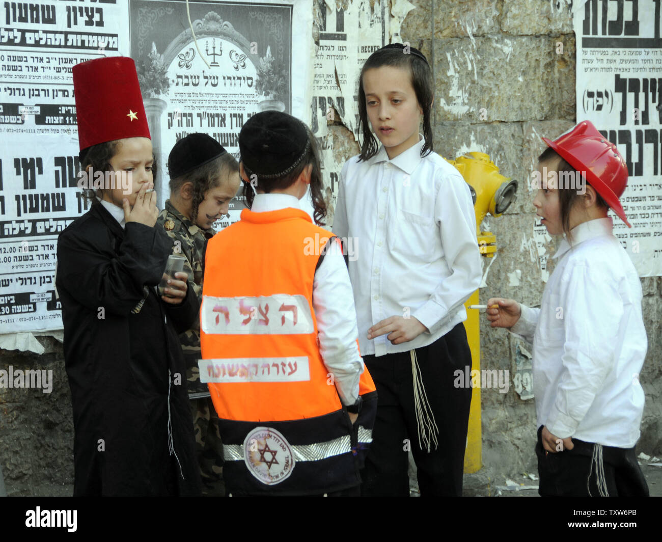 Ultra-Orthodox children smoke cigarettes and wear costumes on the ...