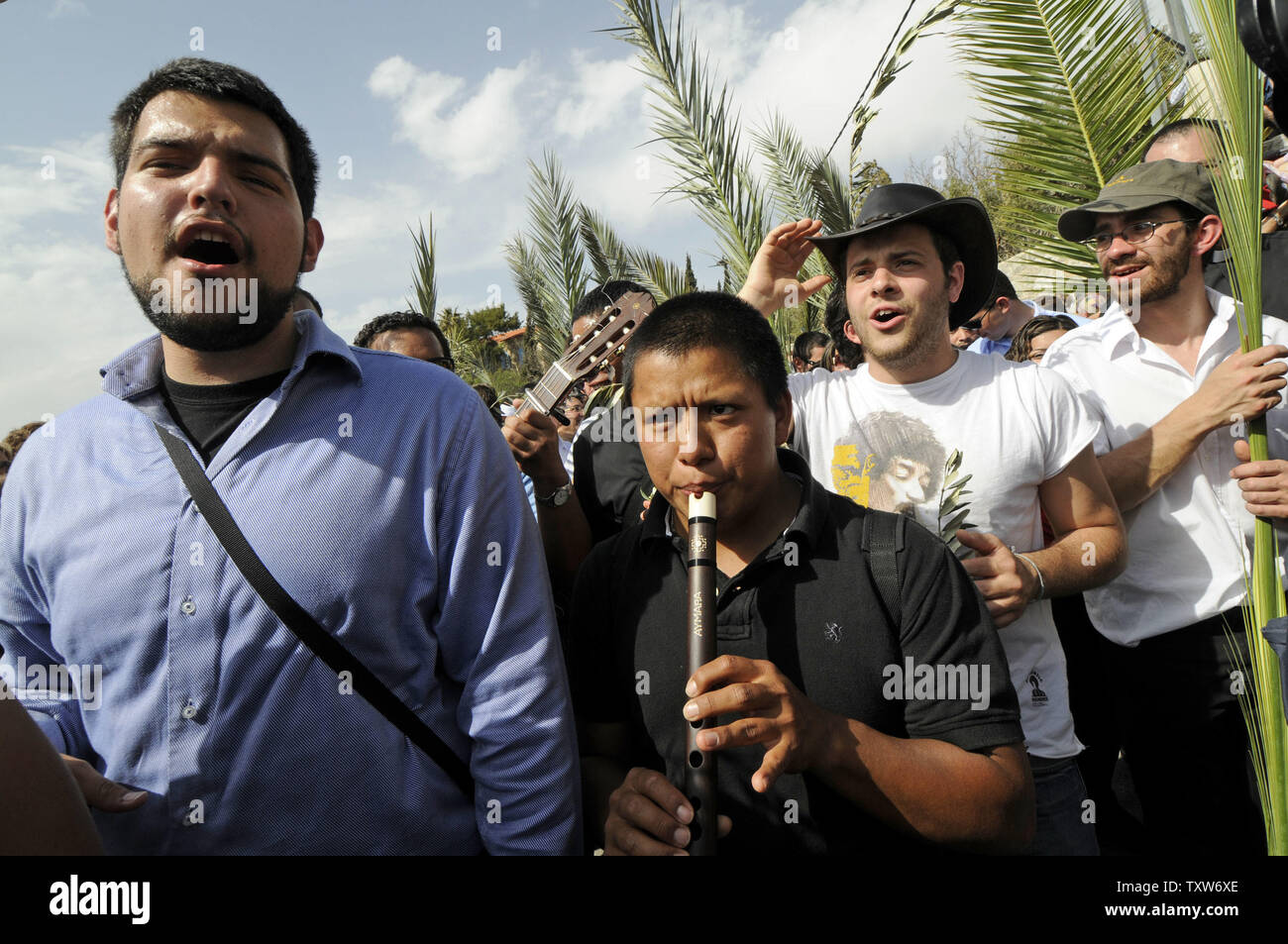 Christian pilgrims sing and wave palm fronds during the annual Palm ...