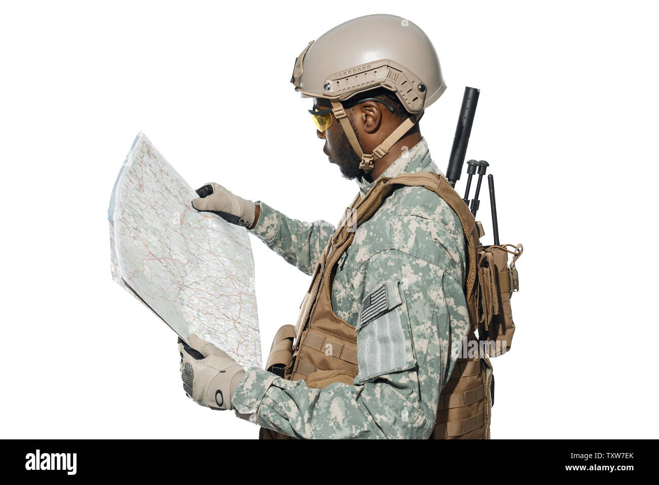 Side view of American soldier exploring terrain by map. Soldier in ...