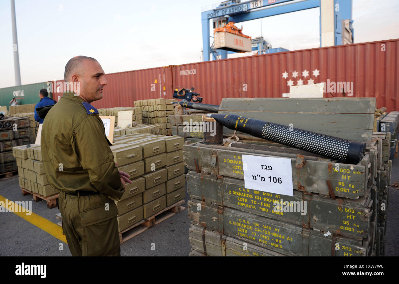 An Israeli officer looks at Iranian supplied arms seized by Israeli ...