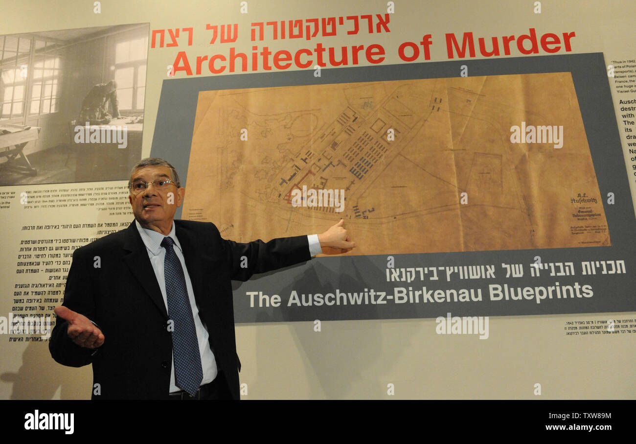 Avner Shalev, Chairman of Yad Vashem, points out details from the ...