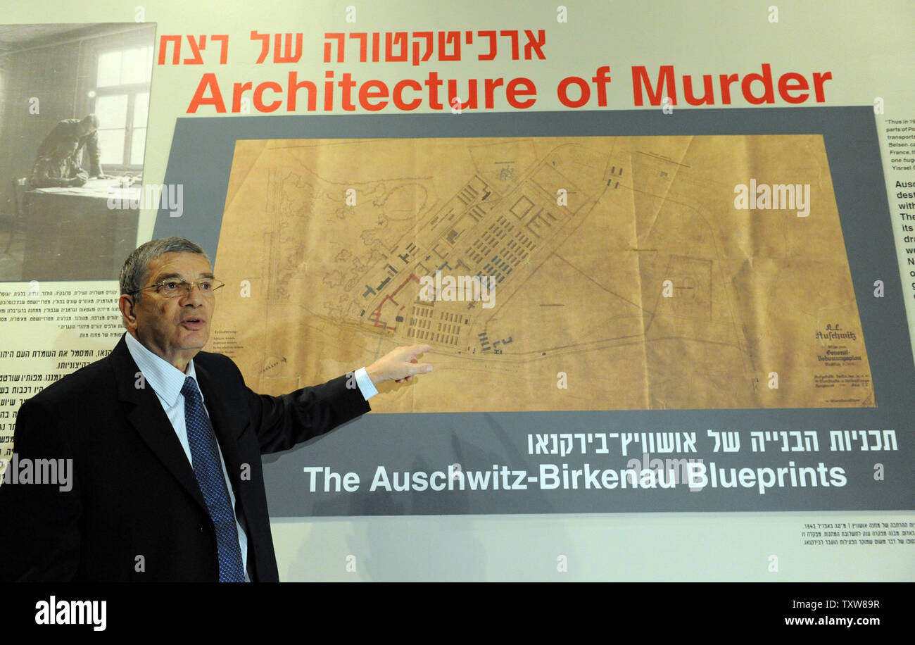 Avner Shalev, Chairman of Yad Vashem, points out details from the ...