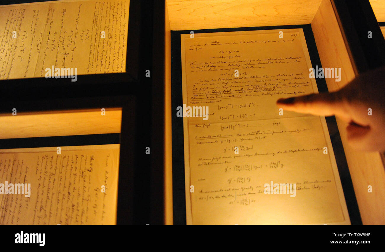 A man points to a page of the original manuscript of Albert Einstein's ...