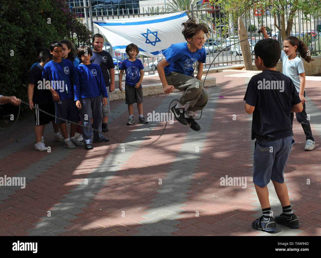 Israeli children jump rope at the Shalom School in Jerusalem before ...