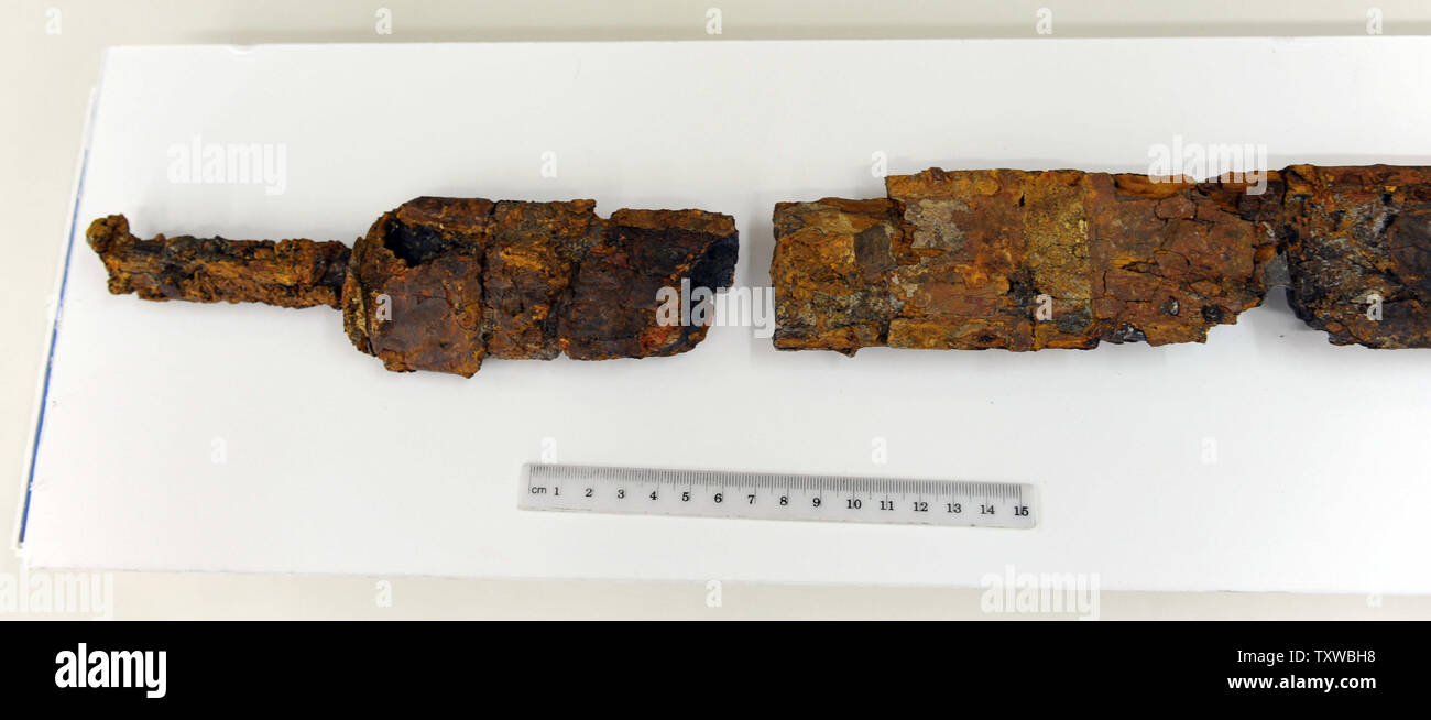 A section of a 2,000 year old iron sword, still in its leather scabbard ...