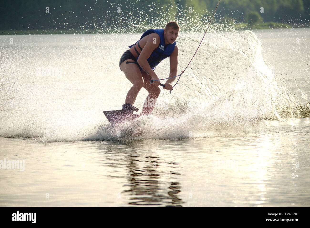 Boat towing wakeboarder hi-res stock photography and images - Alamy