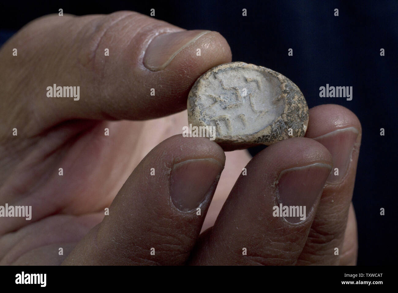 A rare clay seal is displayed during a news conference at the ...