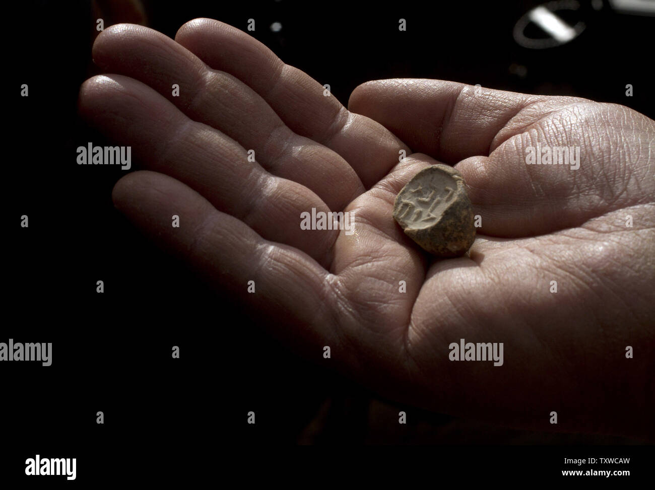 A rare clay seal is displayed during a news conference at the ...