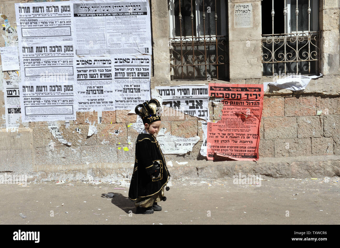 An Ultra-Orthodox Jewish boy wears a Torah costume on the Jewish ...