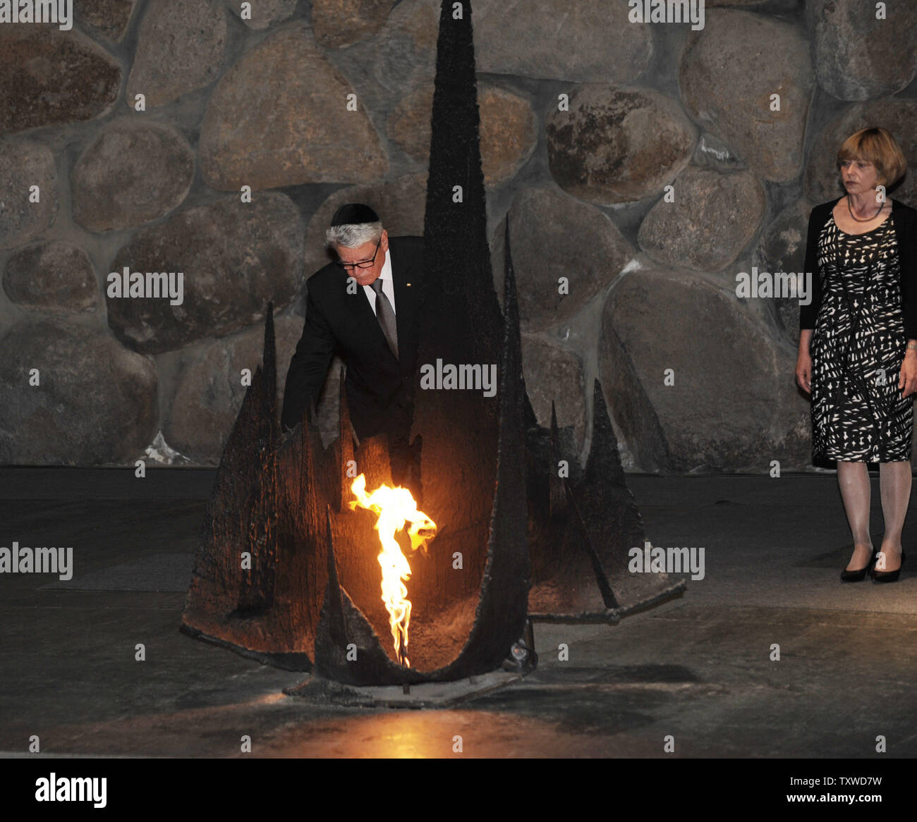 German President Joachim Gauck rekindles the eternal flame during a ...