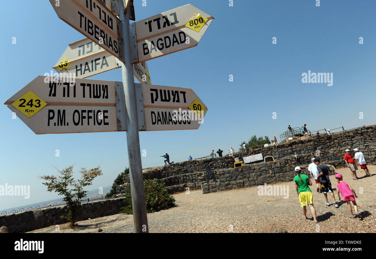 A sign showing different distances, including Damascus, stands near an ...