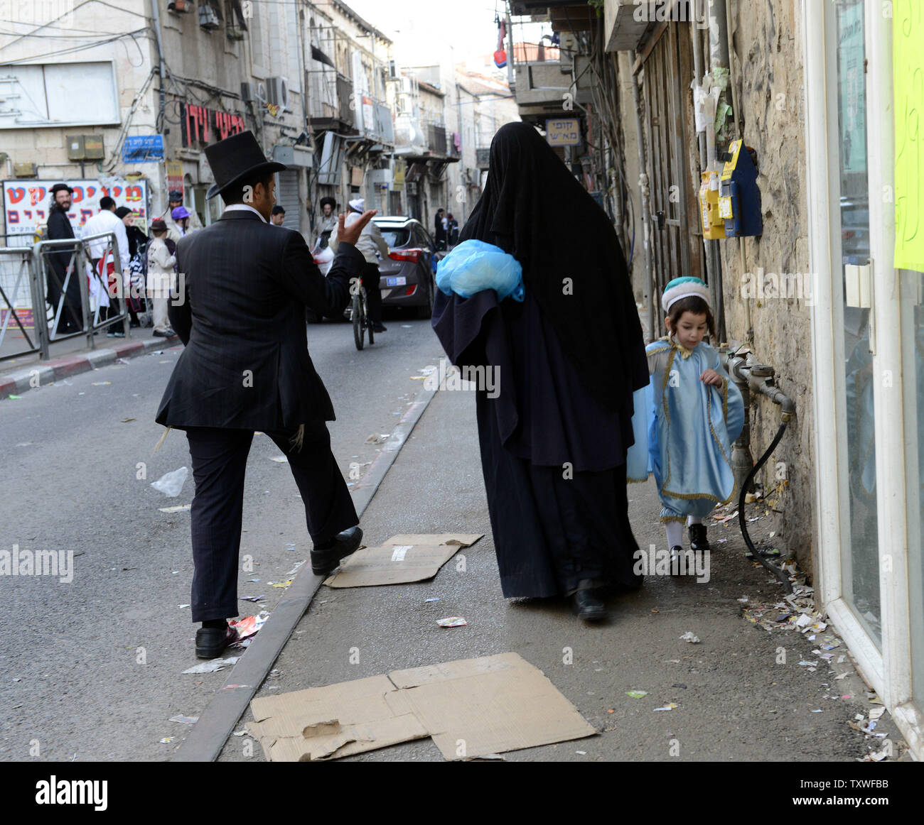 An Ultra-Orthodox Jewish woman wears a cover over her face on the ...