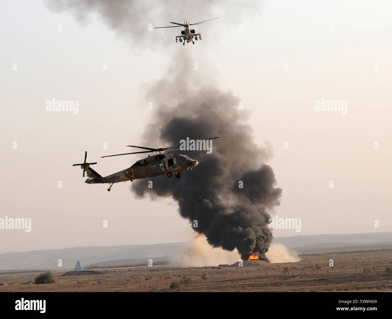 An Israeli Air Force Black Hawk helicopter, foreground, and Apache ...