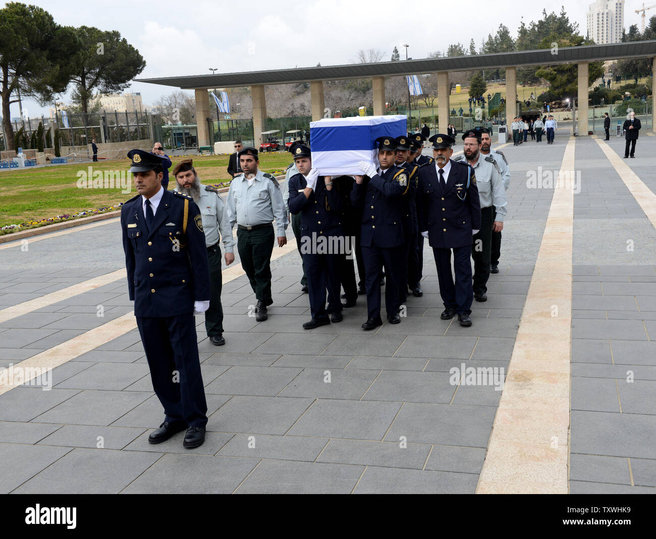 Members of the Knesset guard carry the coffin of the late former ...