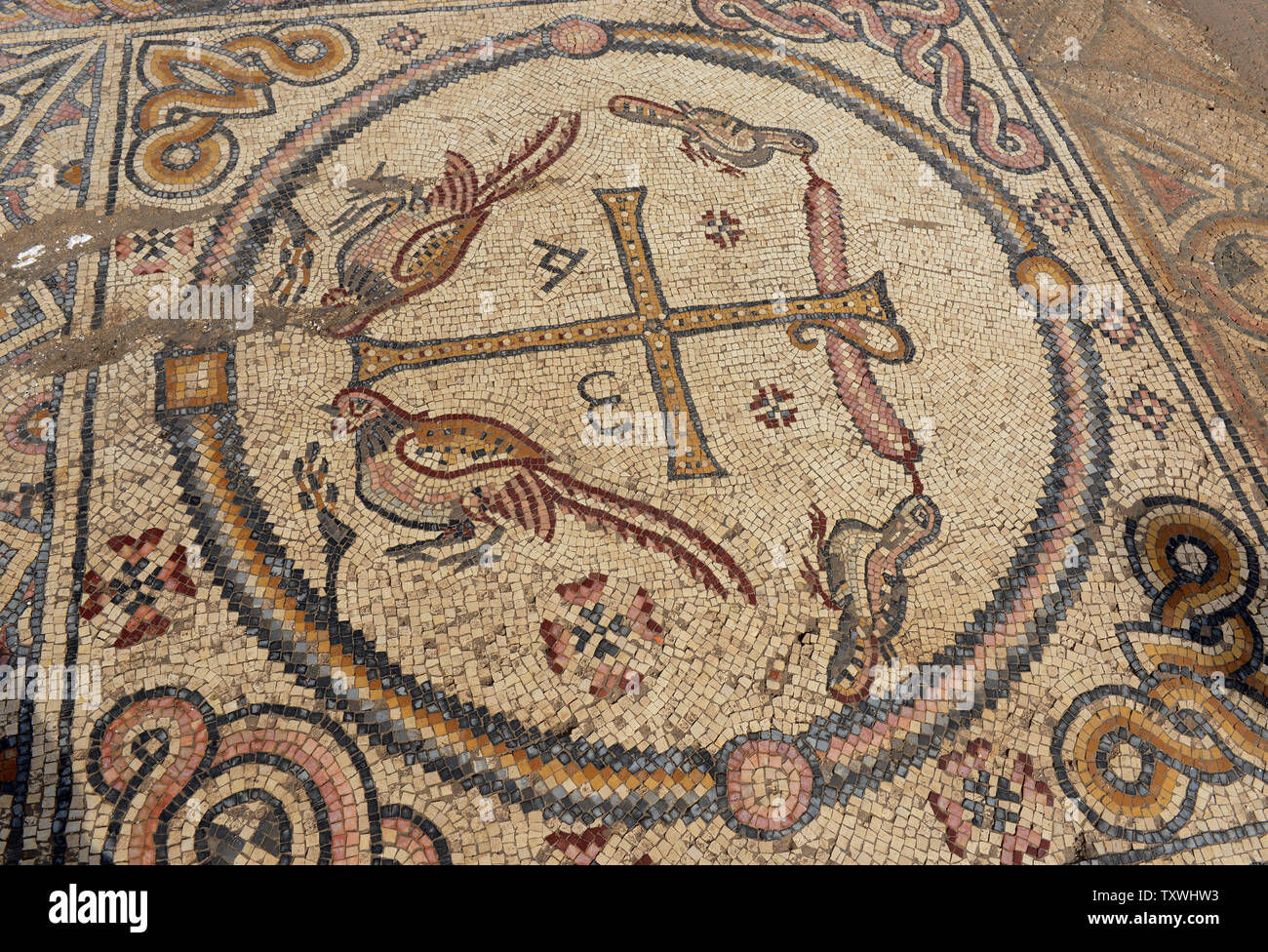 A close-up of a colorful mosaic with ancient inscriptions that was ...