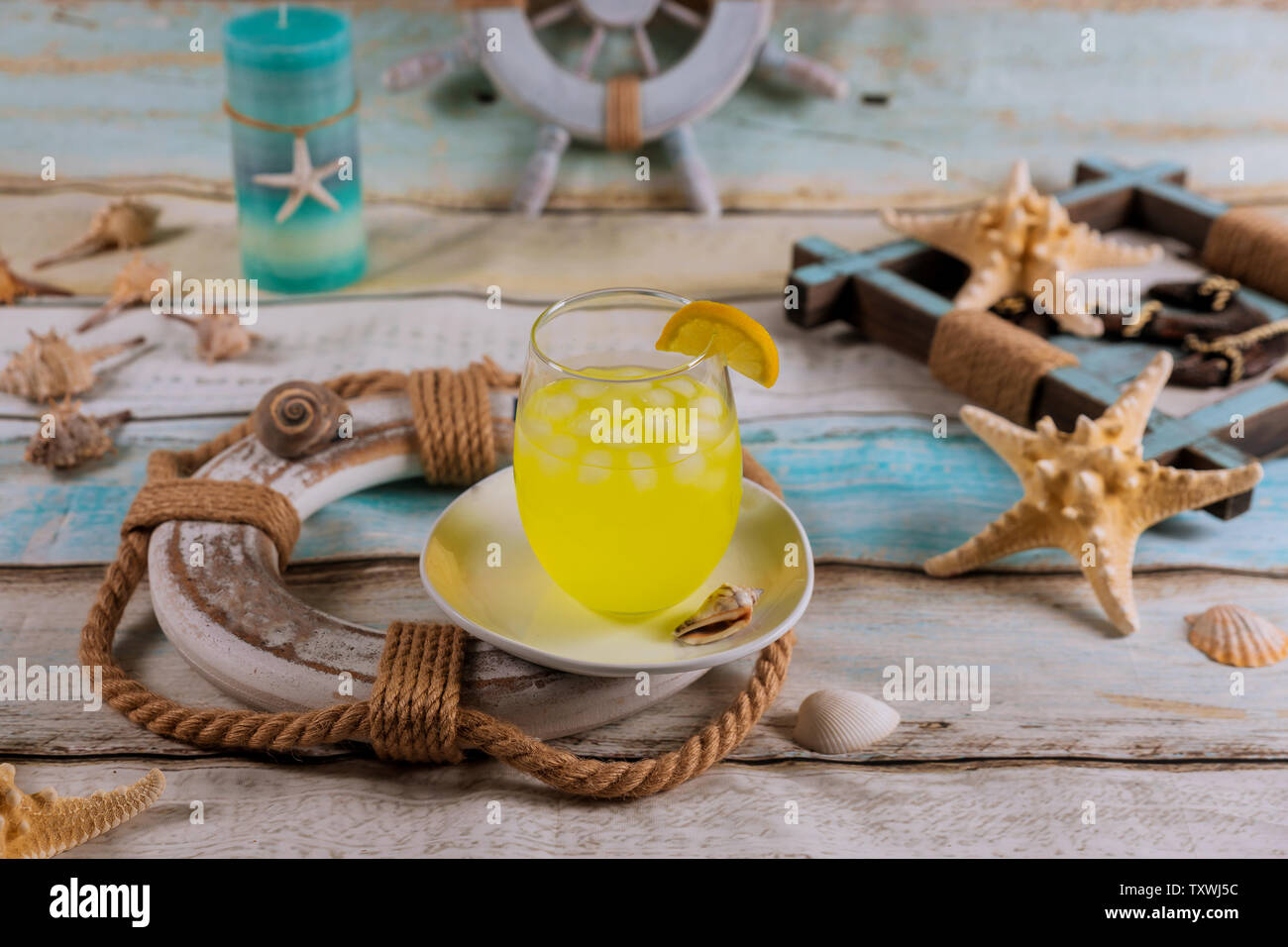 Lemonade drink in cute juice on blue background with copy space ...