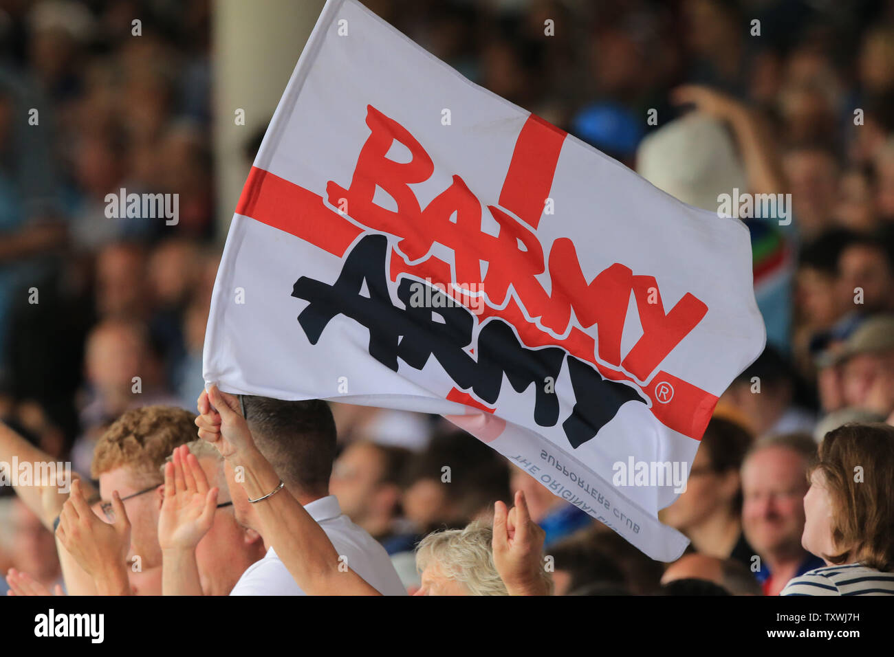 London, UK. 25th June 2019. An England fan waves a Barmy Army flag ...