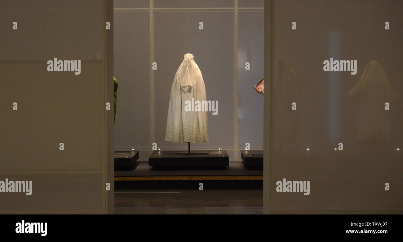 A Jewish women's wrap and face veil from Afghanistan is seen in the ...