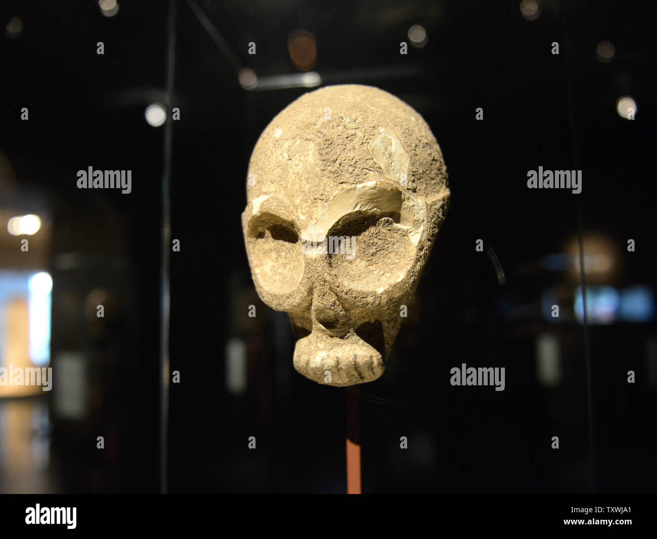 A mask from the Neolithic period (9,000 years ago) is displayed in the ...